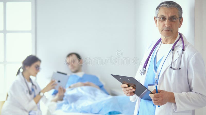 Doctor Checking Heart Beat of Patient in Bed with Stethoscope Stock ...