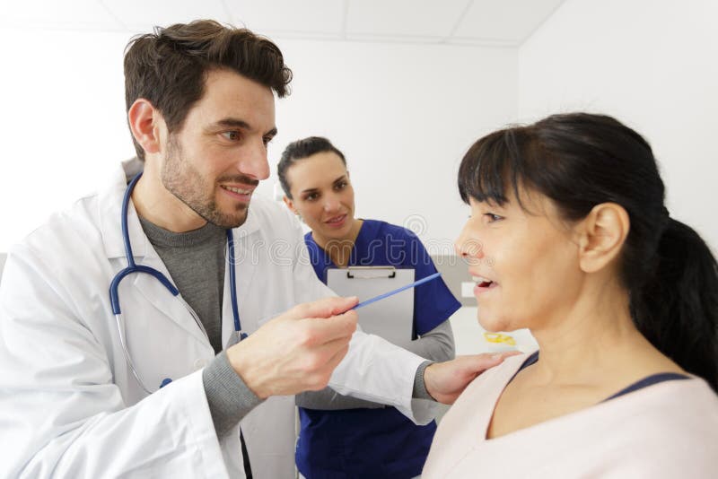 Doctor Checking Inside Mouth Mature Female Patient Stock Image - Image ...
