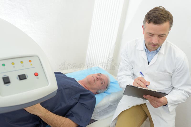 Doctor Checking Medical Record Patient during Scan Stock Photo - Image ...