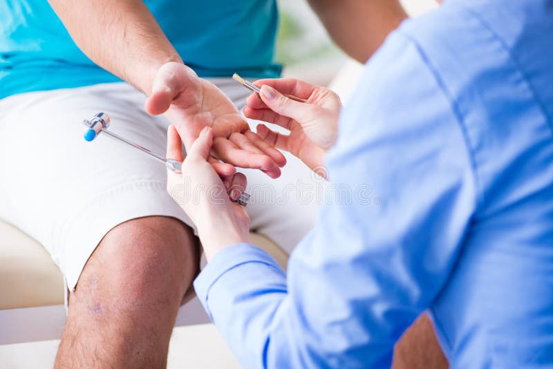 The Doctor Checking Nerve Reflexes with Hammer Stock Photo - Image of ...