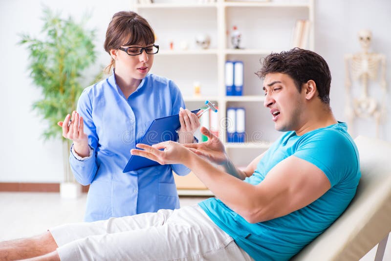 The Doctor Checking Nerve Reflexes with Hammer Stock Photo - Image of ...