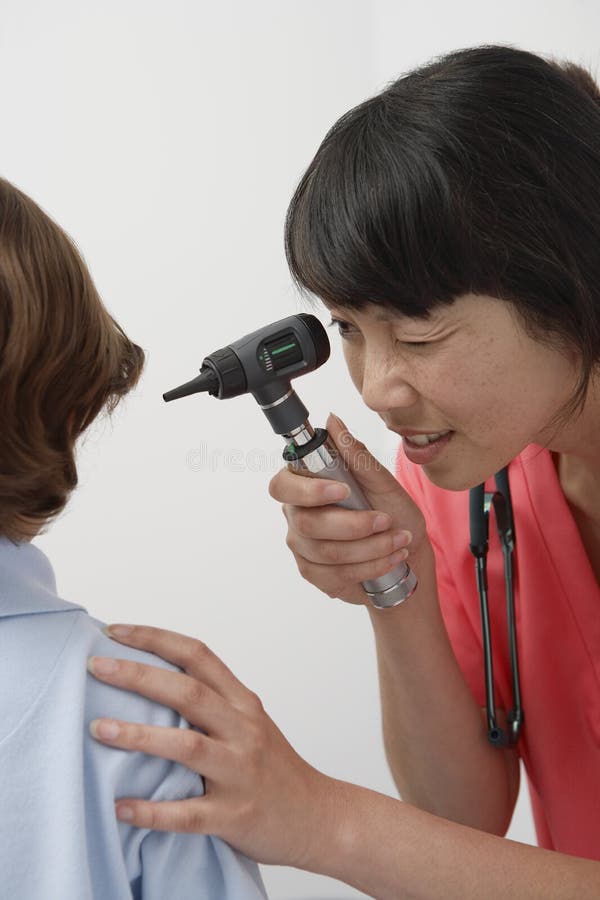 Doctor Checking Patient Ear with Otoscope Stock Image - Image of ...