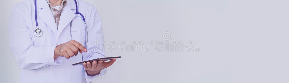 Doctor Checking Patient Information on a Tablet Device Stock Photo ...