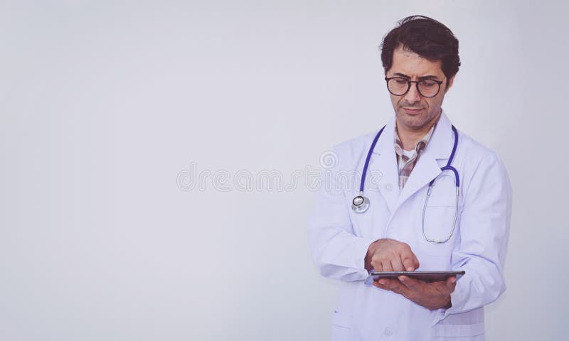 Doctor Checking Patient Information on a Tablet Device Stock Image ...