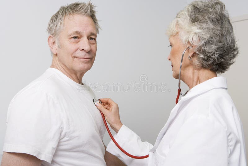 Doctor Checking Patient Using Stethoscope Stock Image - Image of ...