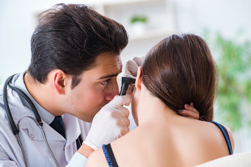 Doctor ENT Checking Ear with Otoscope To Woman Patient Stock Photo ...