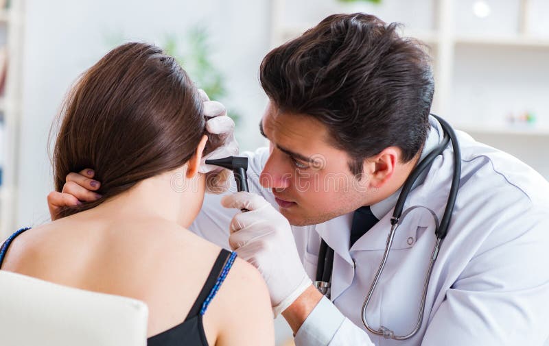 Doctor Checking Patients Ear during Medical Examination Stock Image ...