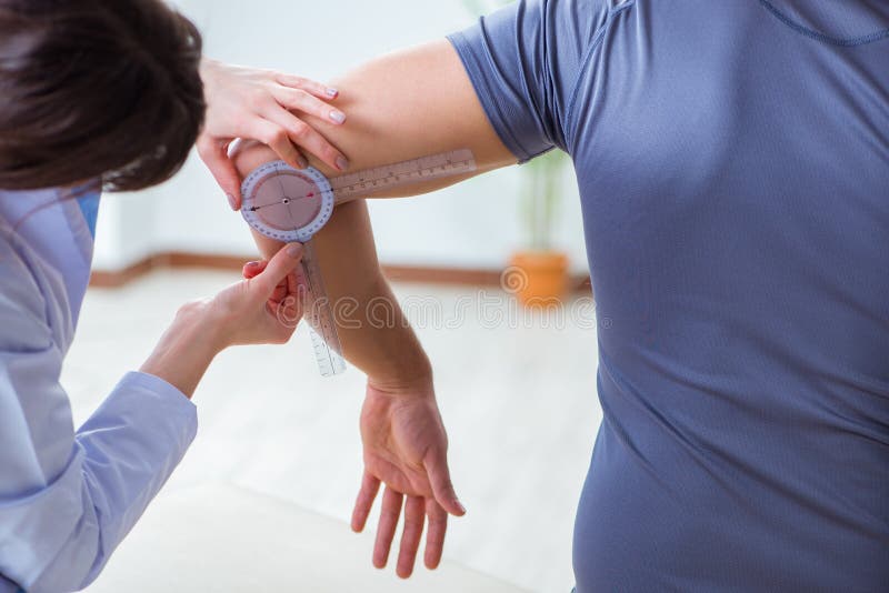 The Doctor Checking Patients Joint Flexibility with Gonimeter Stock ...