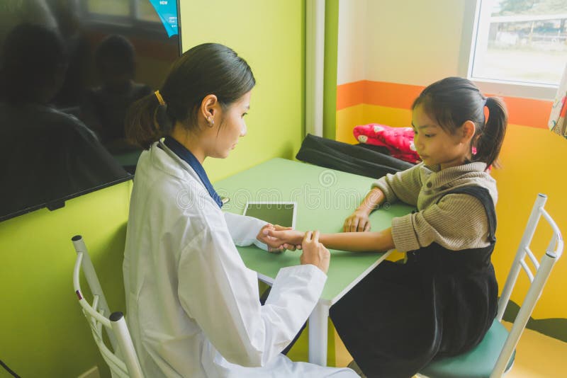Doctor is Checking the Pulse of the Patient Kid Stock Image - Image of ...