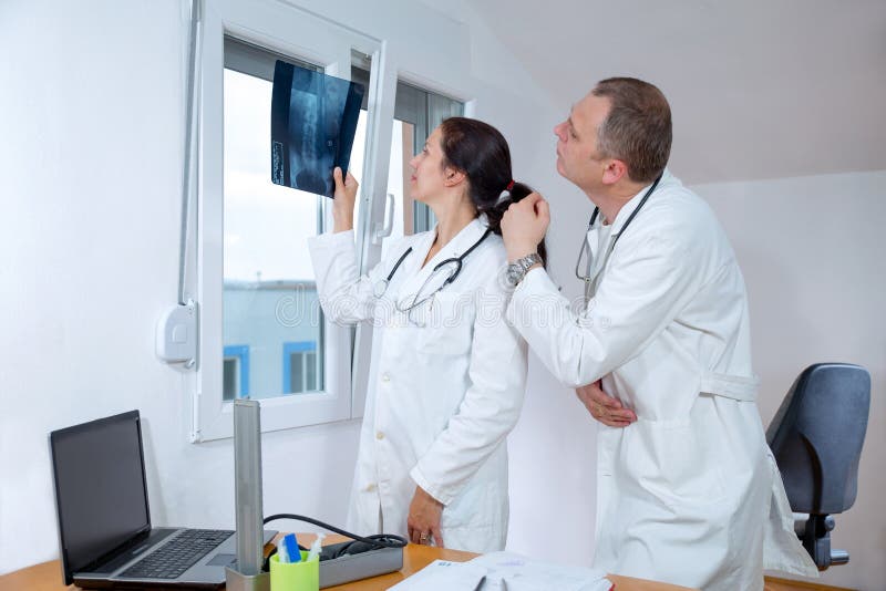 Doctor Checking X-ray Image Stock Photo - Image of emergency, medical ...