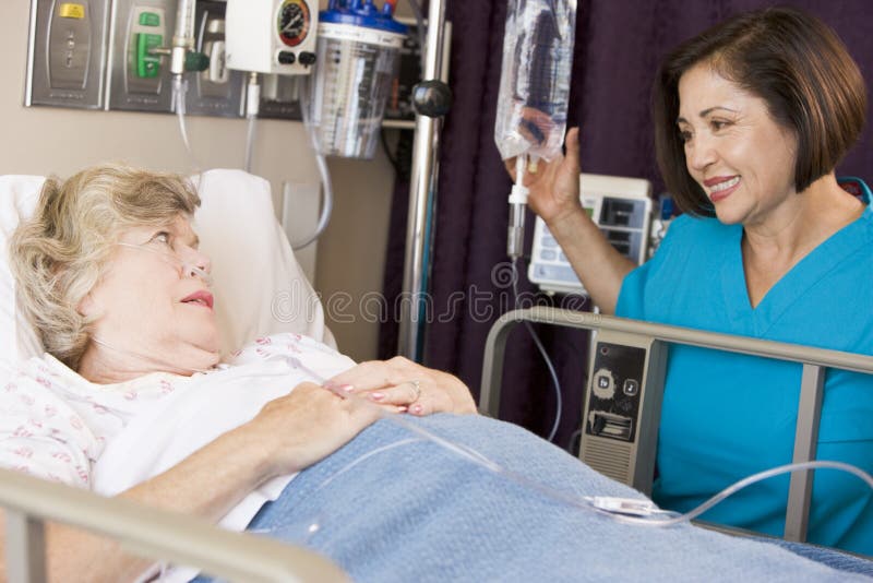 Doctor Checking Up on Senior Woman Stock Image - Image of inside, latin ...