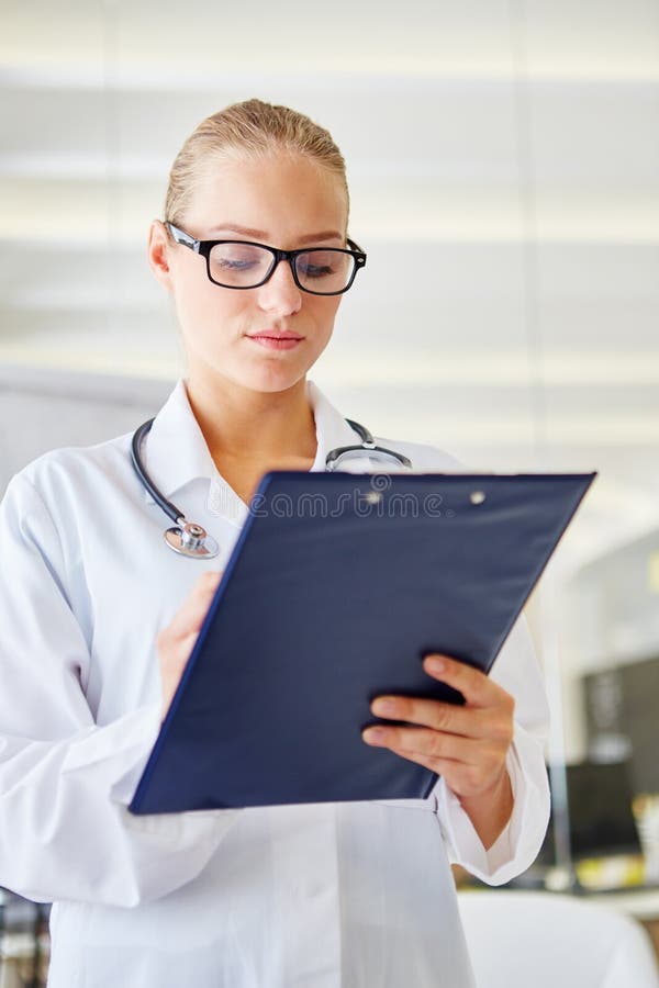 Doctor with Checklist in Radiology Stock Image - Image of happy ...