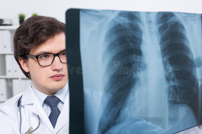 Doctor with chest x-ray stock photo. Image of concept - 70702292