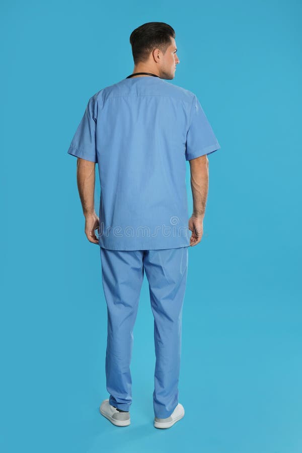 Doctor in Clean Uniform with Clipboard on Background Stock Photo ...