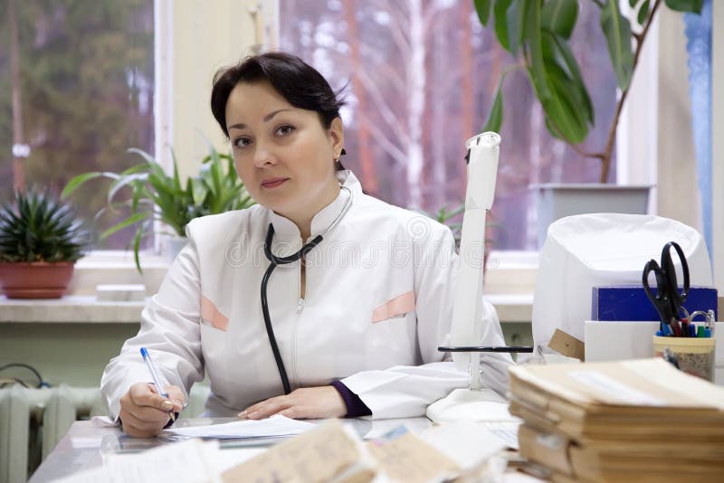 Doctor in clinic interior stock image. Image of sits - 25297551