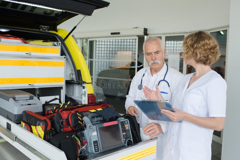 Doctor with Clipping Board Talking To Manager Stock Photo - Image of ...