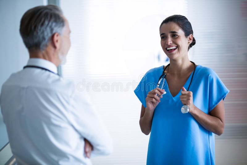 Doctor and Colleague Interacting with Each Other Stock Photo - Image of ...