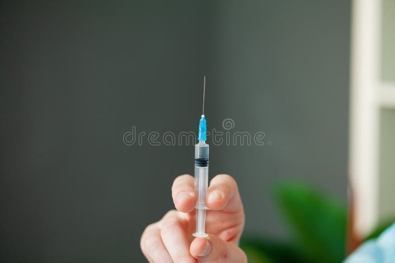 Doctor Comes into a Solution for Injection in a Syringe Stock Image ...