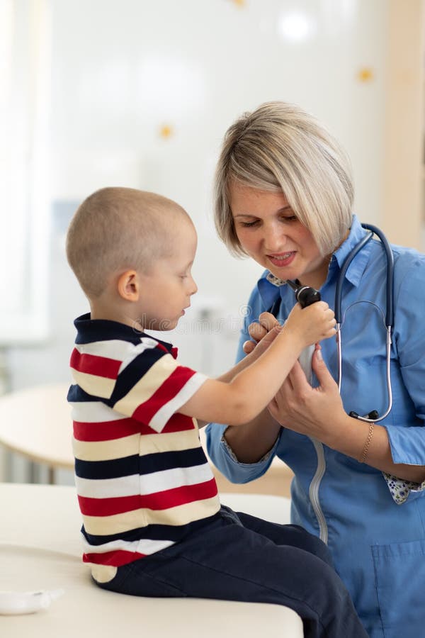 Doctor Communicating with Kid Patient Stock Image - Image of adult ...