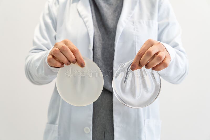 Doctor Comparing Two Silicone Implants. Stock Photo - Image of elastic ...