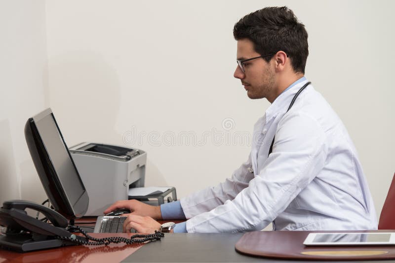 Doctor with Computer stock image. Image of hospital, expertise - 43498587