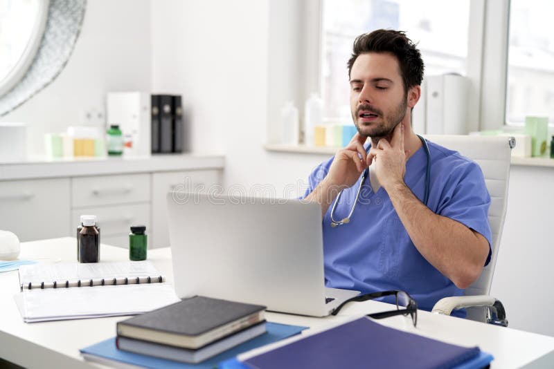 Young Doctor Conducts a Video Consultation Stock Photo - Image of ...