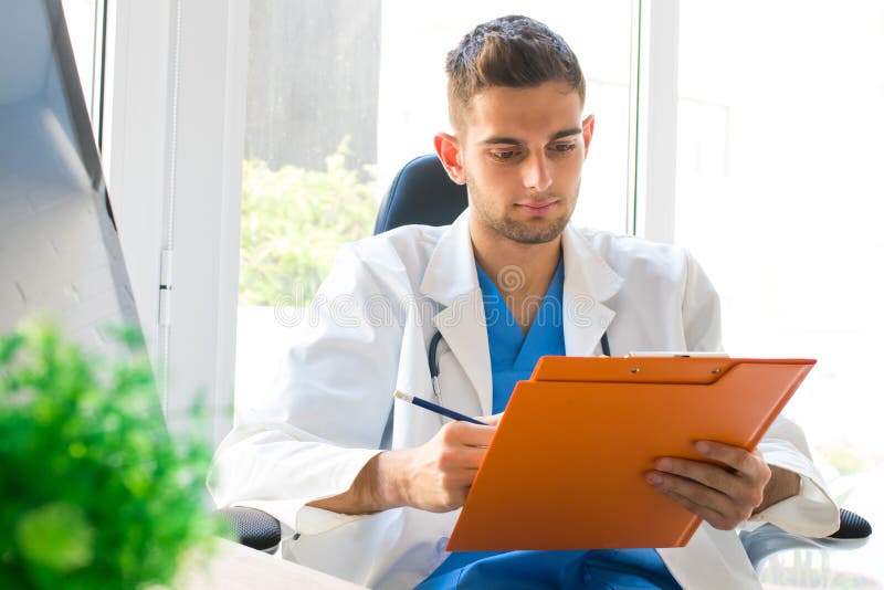 Doctor in Consultation with Documents Stock Photo - Image of people ...