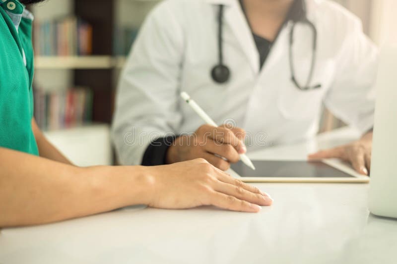 Doctor is Consulting with His Patient Stock Photo - Image of senior ...
