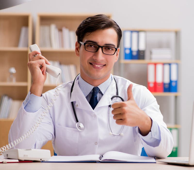 Doctor Consulting Patient Over the Phone Stock Photo - Image of ...