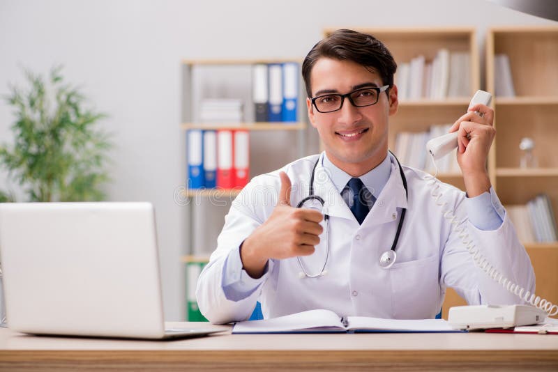 The Doctor Consulting Patient Over the Phone Stock Photo - Image of ...