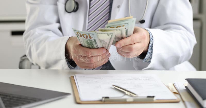 Man Patient Counts Banknotes Sitting at Desk with Doctor Stock Video ...