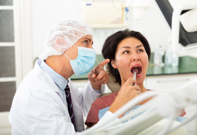 Dentist Examining Patient Teeth with Camera Stock Photo - Image of ... Dentist Examining Patient Teeth with Camera Stock Photo - Image of ...