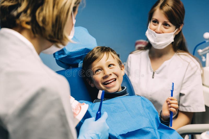 Doctor Dentist Teaching a Child To Brush Teeth. Stock Photo - Image of ...