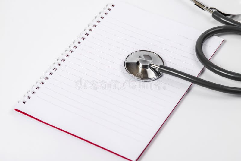 Doctor Desk.Stethoscope and Notebook on White . Stock Image - Image of ...