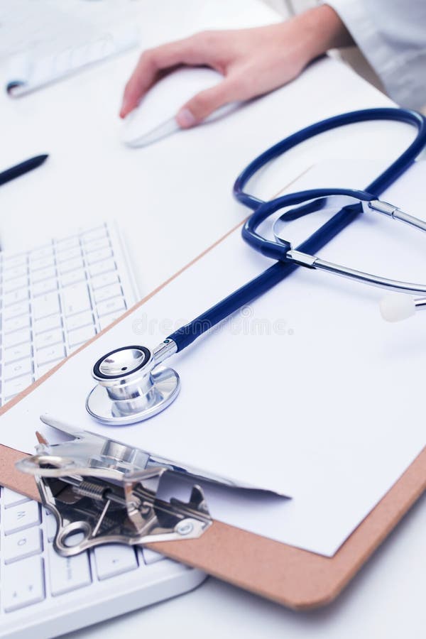 Doctor working at the desk stock photo. Image of material - 116001698