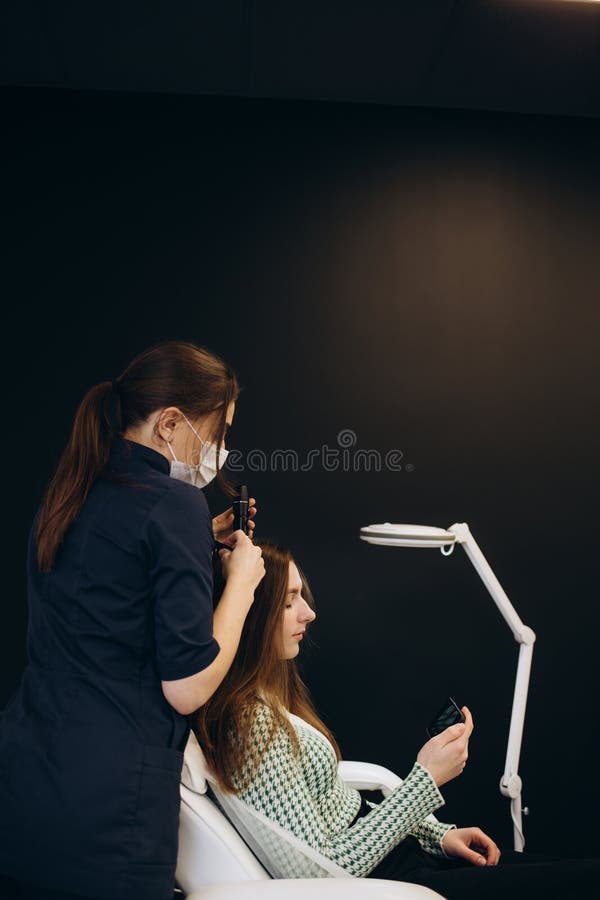 Doctor Diagnoses the Structure of the Hair. Consultation with a ...