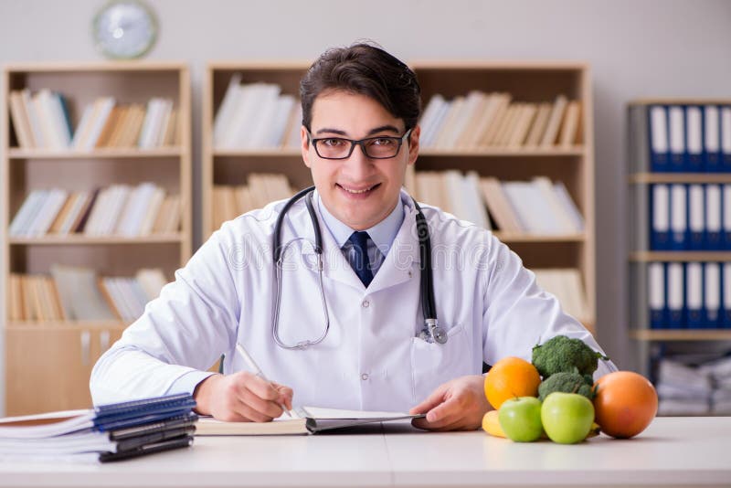 The Doctor in Dieting Concept with Fruits and Vegetables Stock Photo ...