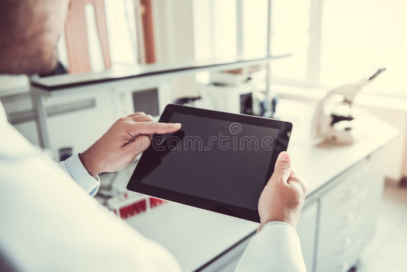 Doctor with digital tablet stock photo. Image of handsome - 90759550