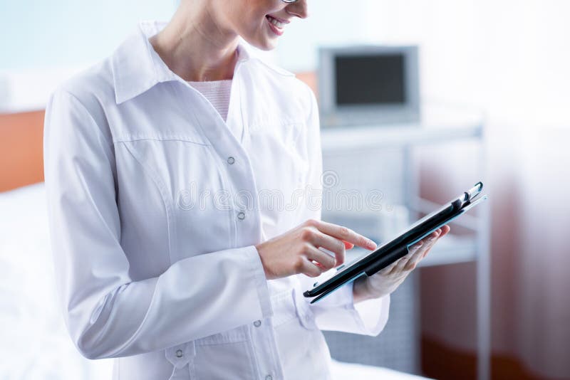 Doctor with digital tablet stock photo. Image of woman - 90542606