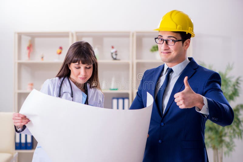 The Doctor Discussing New Hospital Plan with Architect Stock Image ...