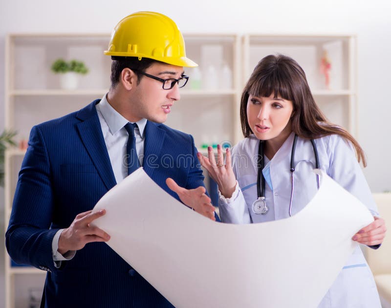 Doctor Discussing New Hospital Plan with Architect Stock Photo - Image ...