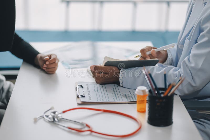 Doctor Discussing with Patient in Hospital Stock Image - Image of ...