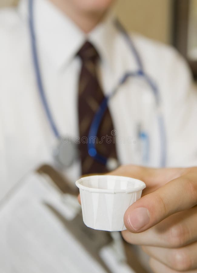 Doctor Dispensing Medicine Pills in Cup_2 Stock Image - Image of paper ...
