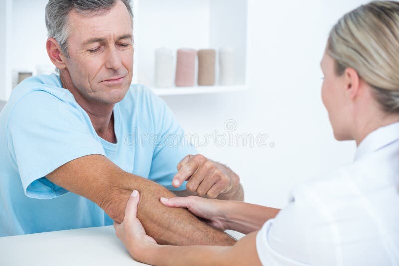 Doctor doing arm massage stock photo. Image of adult - 54257708