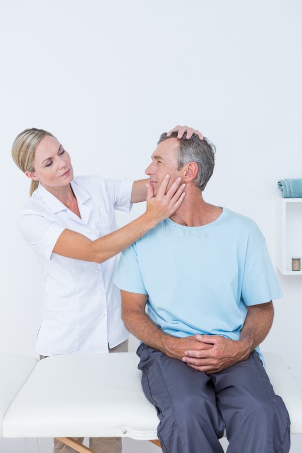 Doctor Doing Neck Adjustment Stock Photo - Image of chiropractic ...