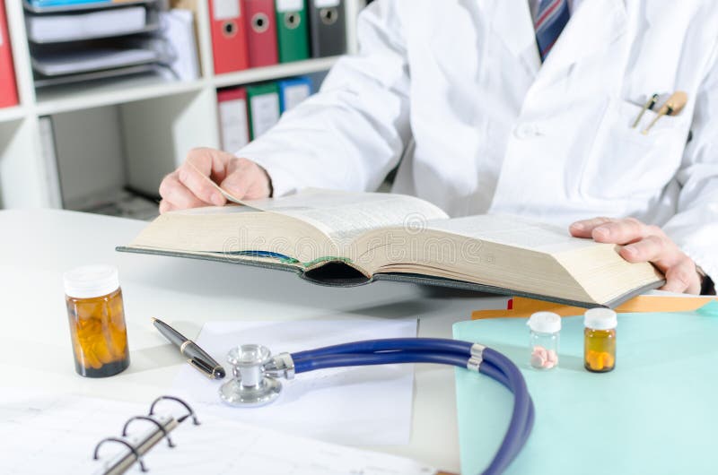 Doctor Doing Research in a Medical Book; Panoramic Banner Stock Photo ...