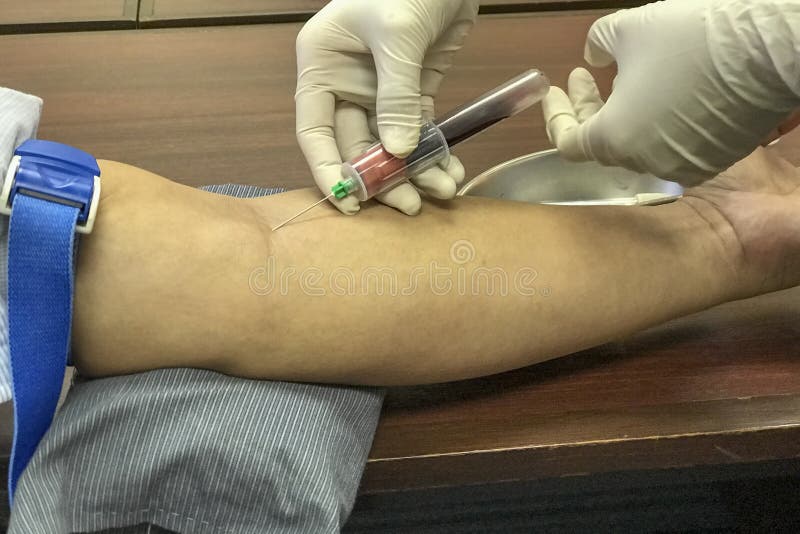 The Doctor Draw the Patient`s Blood by Syringe Stock Image - Image of ...