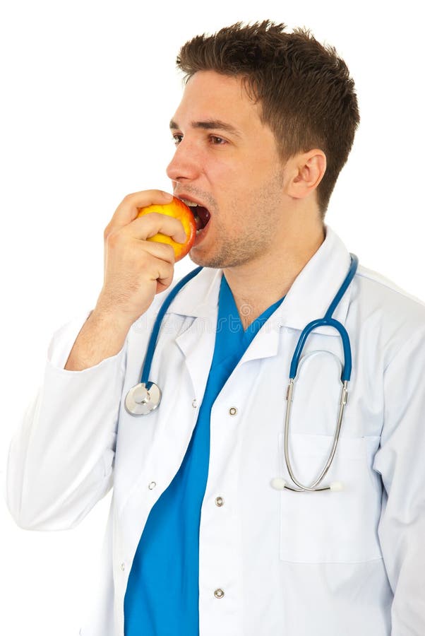 Doctor eating apple stock photo. Image of hold, apple - 24287860