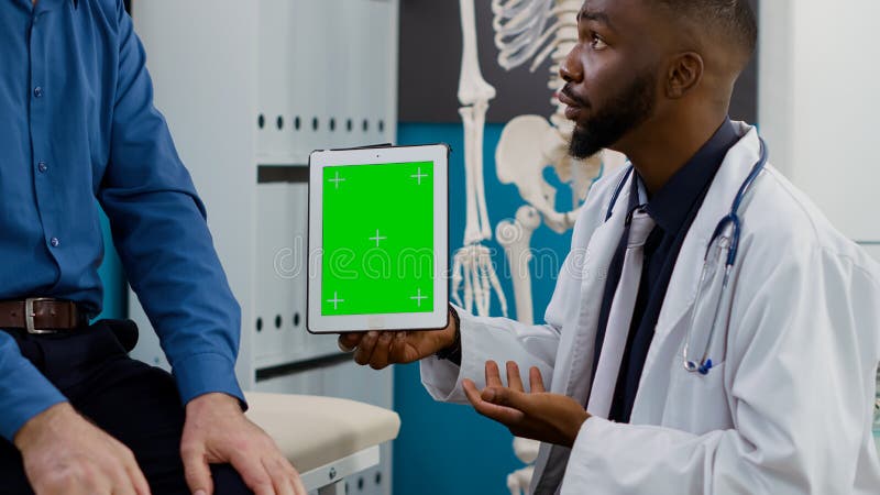 Doctor and Elderly Patient Looking at Greenscreen Display Stock Image ...