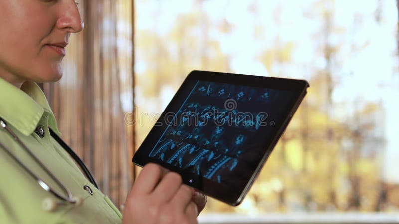 A Doctor Examines a Computed Tomography Scan of the Thyroid Gland on a ...